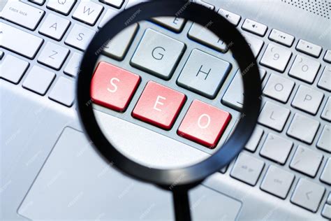 Premium Photo Magnifying Glass And Computer Keyboard With Text Seo