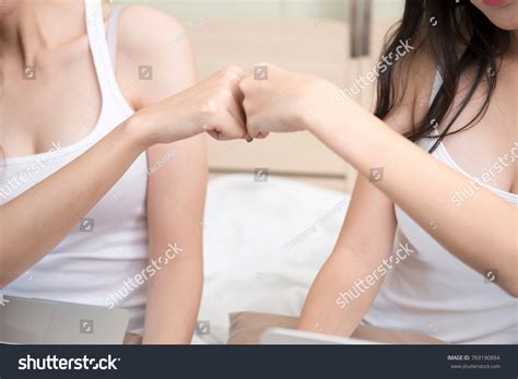 Couple Sexy Girls White Bump Fist Stock Photo Edit Now 769190884