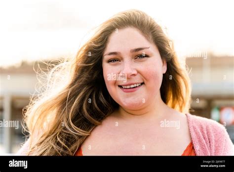 Beautiful And Cheerful Plus Size Young Woman Outdoors Pretty