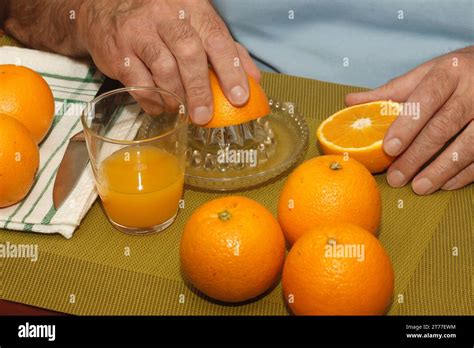 Man Orange Hand Squeezing Hi Res Stock Photography And Images Alamy