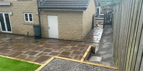 Artificial Grass With Retaining Wall And Sandstone Patio Project Meadow Drives