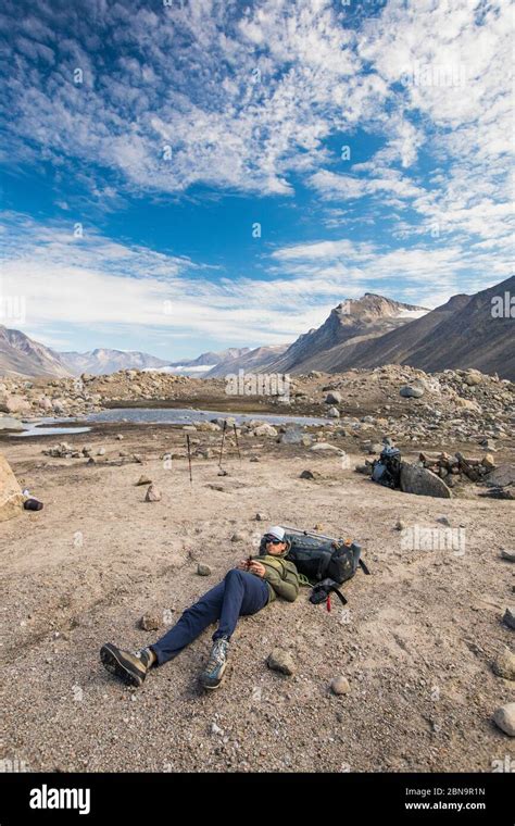 Man Relaxes And Uses GPS Navigation Device To Map Out His Travel Route Stock Photo Alamy