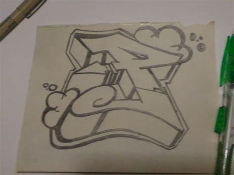 A Piece Of Paper With Graffiti On It Next To Two Markers And A Marker Pen