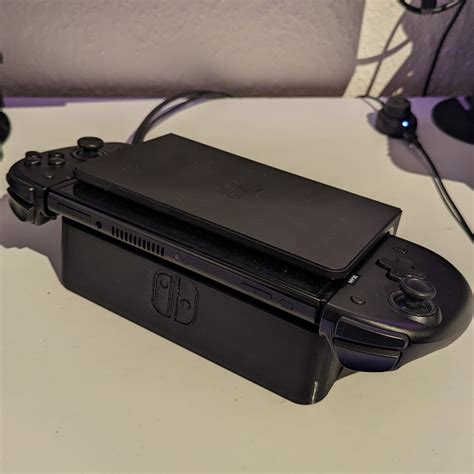 Nintendo Switch OLED Dock Cradle by René Petersen Download free STL model Printables com