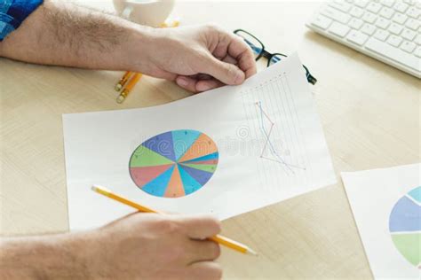 Man Analyzes The Data And Graphs Business Analysis Strategy Co Stock Photo Image Of