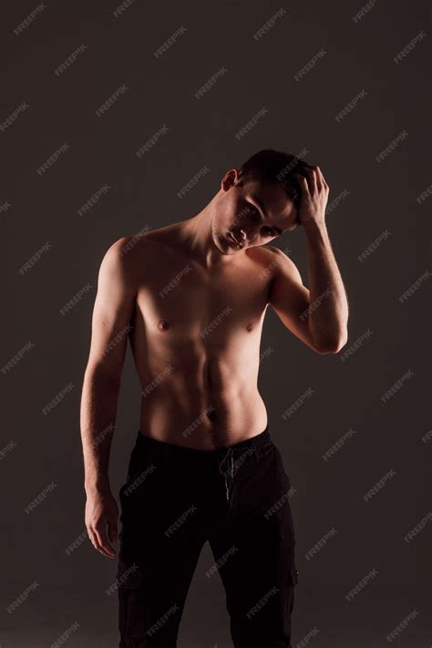 Premium Photo Handsome Young Man With Naked Body On Black Background