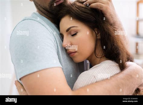 Couples Hugging And Crying