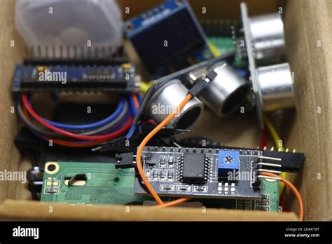 I C LCD Module And Ultrasonic Distance Sensor Along With Other Electronic Components In A Box