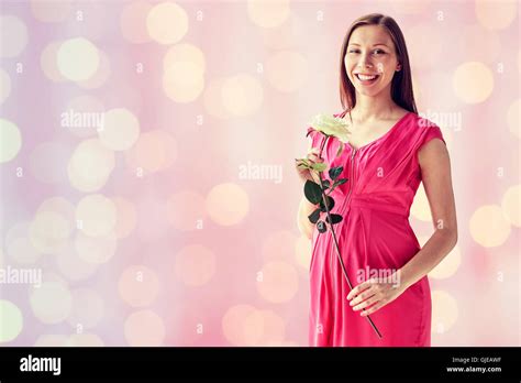 Happy Pregnant Woman With Rose Flower Stock Photo Alamy