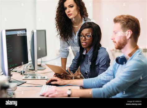 software engineers working on project and programming in company stock