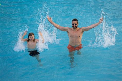 Premium Photo Father And Son In Swimming Pool On Summer Vacation