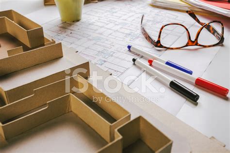 Closeup Of Building Model And Drafting Tools On Construction Pla Stock