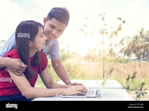 Love Couple Talking And Working On Computer Husband And Wife Smile And