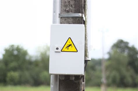 Closeup Of A Warning Sign On An Electric Box With A Yellow Danger Sign Of Being Shocked Stock