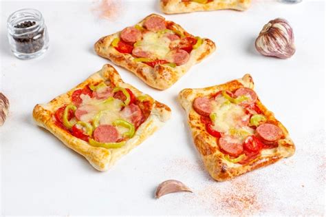 Free Photo Puff Pastry Mini Pizzas With Sausages