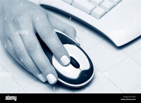 Female Hand Holding Computer Mouse Stock Photo Alamy