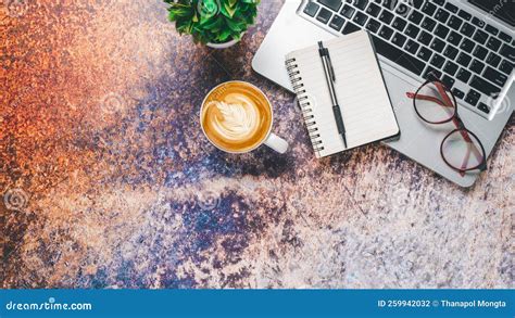 Vintage Office Desk With Laptop Computer Eyeglass Cup Of Coffee Pen