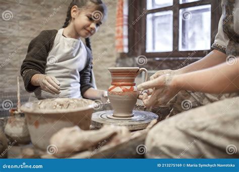 Girl Playing With Modeling Clay On Pottery Wheel At Workshop Craft Art Artisan Hobby And