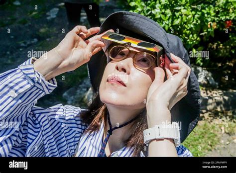 Quezon City Philippines 20th Apr 2023 A Woman Uses A Special Sunglass To Watch The Partial