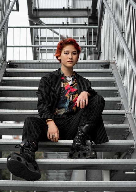 Free Photo Redhead Non Binary Person Sitting On Stairs