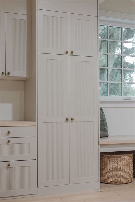 Diy Fluted Doors Gave A Storage Wall A Custom Look Semistories