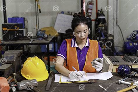 Asian Woman Technician Engineer Working Designing And Drawings