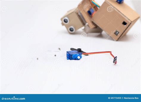 Assembly Cardboard Robot And The Necessary Parts For This Stock Image
