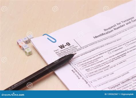 Irs Form W 9 Request For Taxpayer Identification Number And Certification Blank Lies With Pen