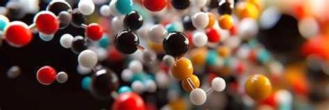 Atoms And Molecules Interacting In Colorful Abstract Representation