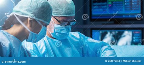 Diverse Team Of Professional Medical Surgeons Perform Surgery In The