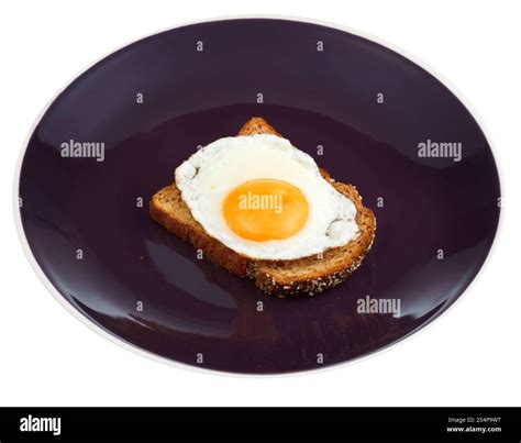 Sandwich From Fried Egg And Toasted Rye Bread On Plate Isolated On