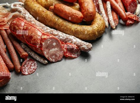 Different Types Of Sausages On Grey Table Stock Photo Alamy