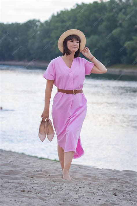 Premium Photo Beautiful Girl In A Pink Dress On The Beach Near The River