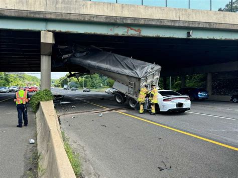 Wild Capital Beltway Crash Involves Trailer Wedged In Overpass Sedan