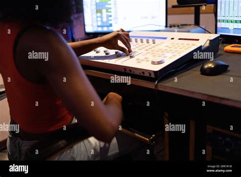 Crop Anonymous African American Female Audio Engineer Creating Music
