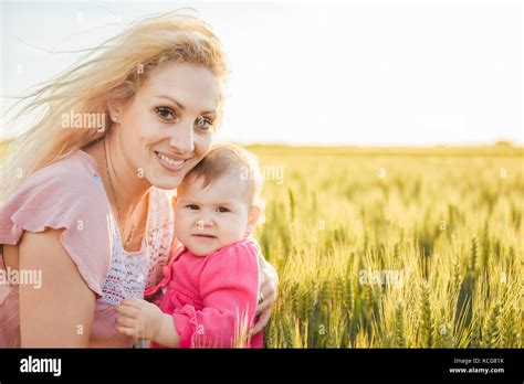 Mother Holding Baby Girl In Arms Hi Res Stock Photography And Images