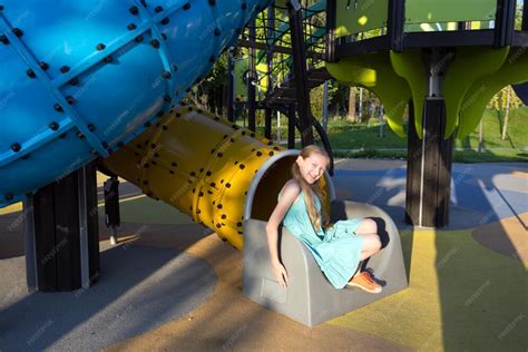 Premium Photo Girl At The Large Beautiful Playground In The Park
