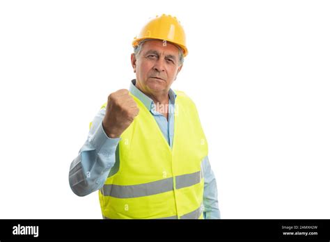 Aggressive Male Construction Worker Holding Fist Up As Fighting Concept