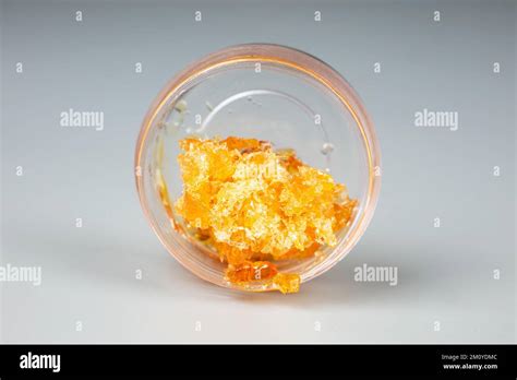 Orange Golden Extract Cannabis Dab In A Bottle Wax With High Thc Stock