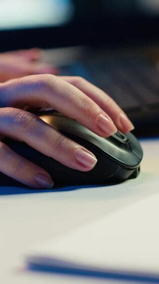 Vertical Extreme Close Up Shot Of Editor Selecting Key Frames To Use While Doing Montage