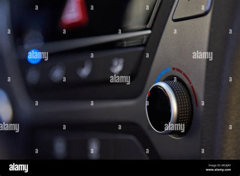 Car Climate Control Knob Close Up On Blurred Dashboard Background Stock