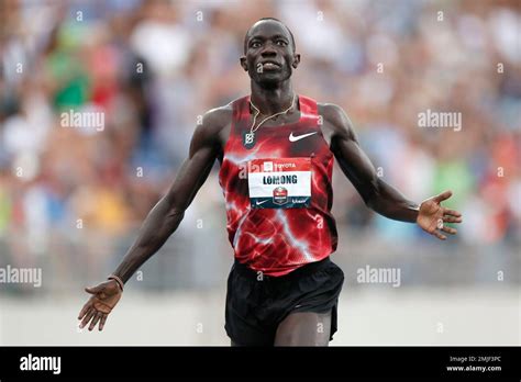 Lopez Lomong Crosses The Finish Line As He Wins The Mens 5000 Meter
