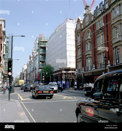 Building Covered With A Safety Scaffolding Net Stock Photo Alamy