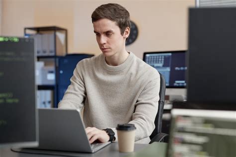 Premium Photo Man Programmer Using Laptop