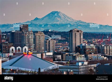 Mount Rainier Above The Seattle City Skyline At Dusk Seattle Wa Stock