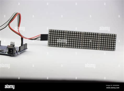 homemade electronics project that shows micro controller board connected to a led dot matrix