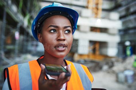 Leveraging New Technology For Large Scale Construction A Young Woman Using A Smartphone While