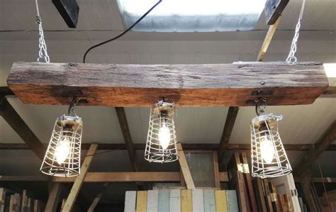 M1183 An Industrial Hanging Cage And Oak Beam Ceiling Light In Antique
