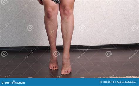 Female Legs Girl Takes Off Panties Standing On Tiptoes Stock Footage