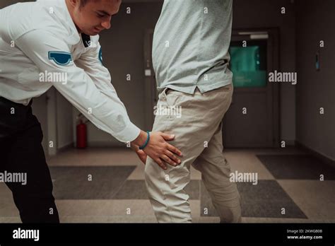 Security Guard Making Body Searching Procedure On Man For Finding Hidden Objects Before Entering